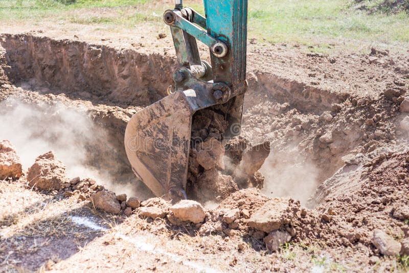 Working Excavator Tractor Digging a Trench. Stock Photo - Image of ...