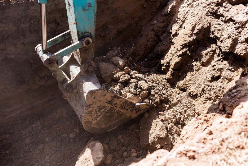 Working Excavator Tractor Digging a Trench. Stock Photo - Image of ...