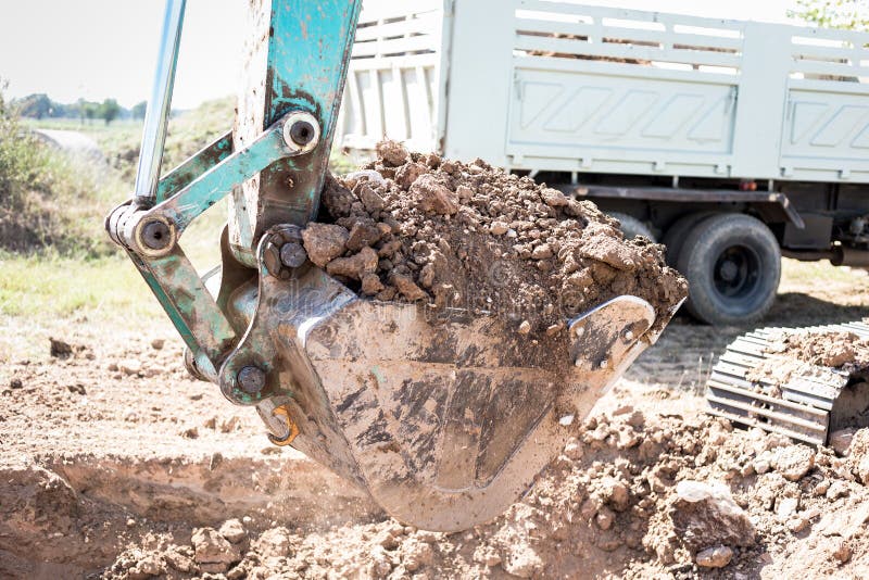 Working Excavator Tractor Digging a Trench. Stock Photo - Image of ...
