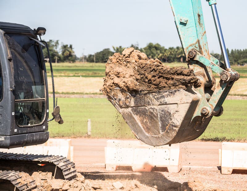 Working Excavator Tractor Digging a Trench. Stock Photo - Image of ...