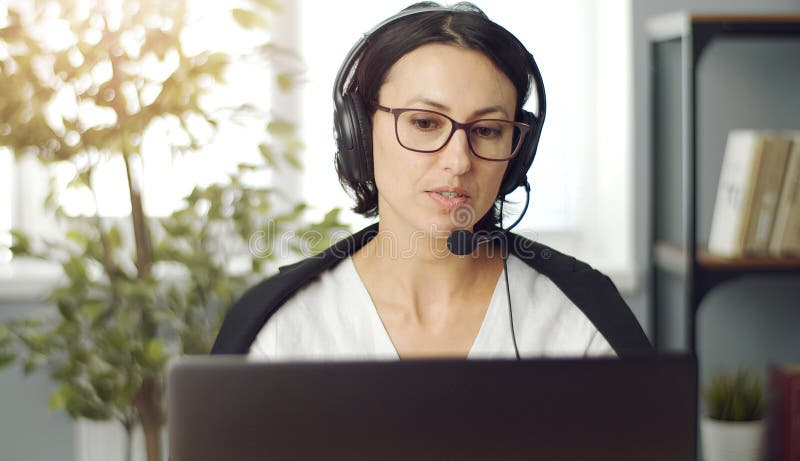 Working Female Speaking through Headset Stock Image - Image of customer ...