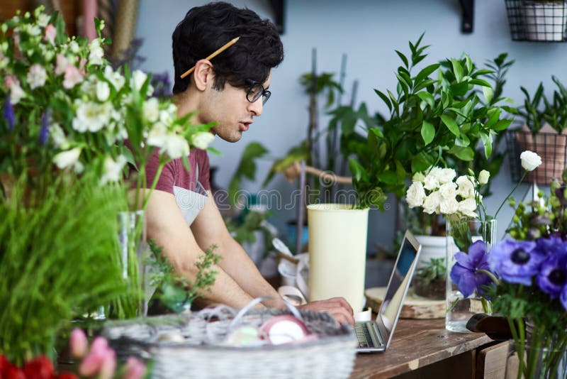 Working florist stock image. Image of typing, browsing - 88129091
