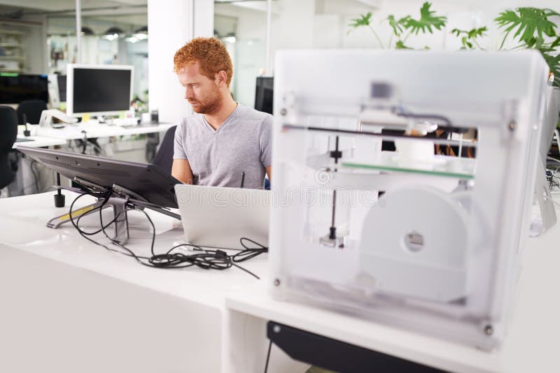 Working on Getting Some Models Printed. a Shot of a Young Man Printing ...