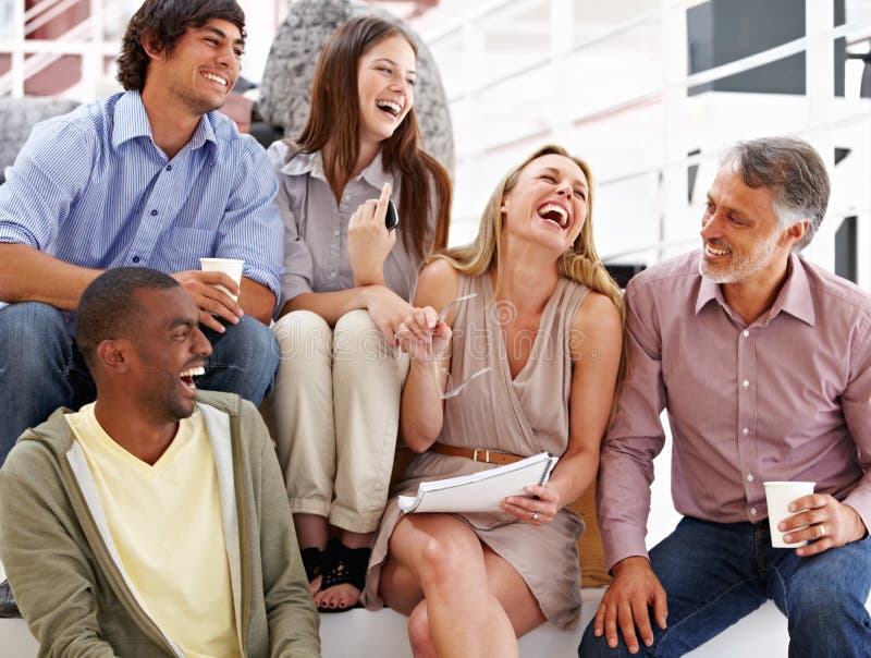 Working with a Great Team. a Team of Designers Laughing at Their ...