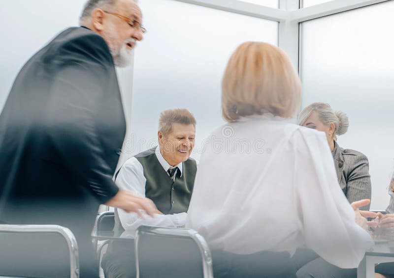 Working Group Sitting at a Table in the Conference Room. Stock Image ...