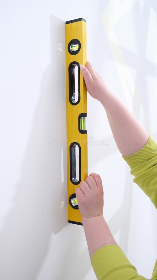 Working Hands Check Evenness of Wall with Special Tool for Measuring ...
