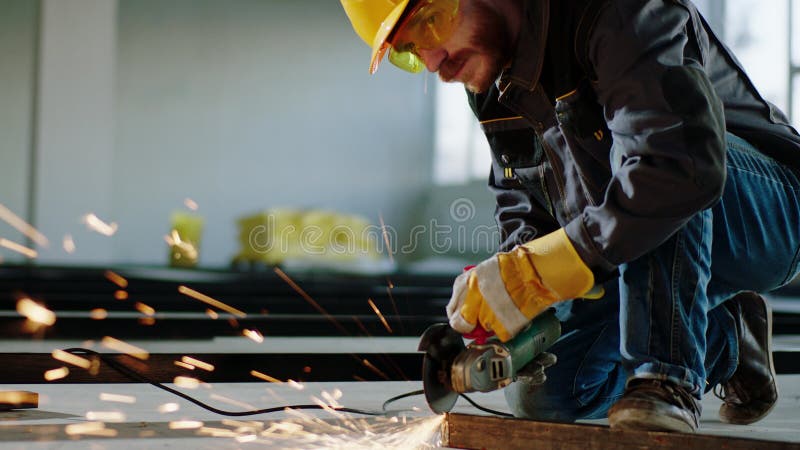 Working Hard at Construction Site by a Constructor Worker Using the ...