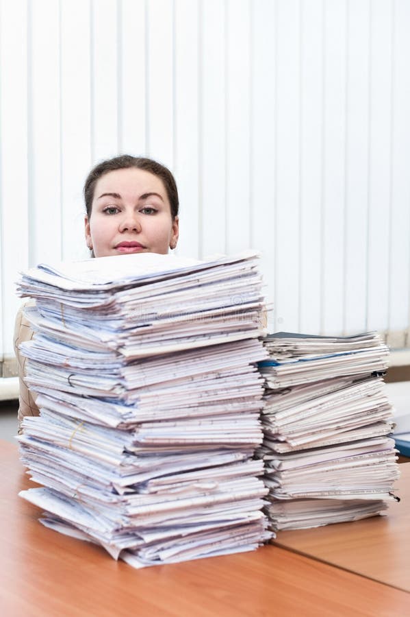 Man in stacks of paperwork stock photo. Image of clerk - 41842594