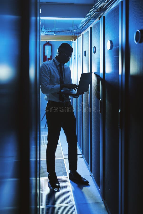 Working Hard To Keep Your Information Safe. a Young Man Working in an ...