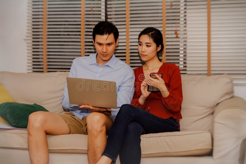 Working at Home Couples Look after Laptops, Computers, Internet, Online ...