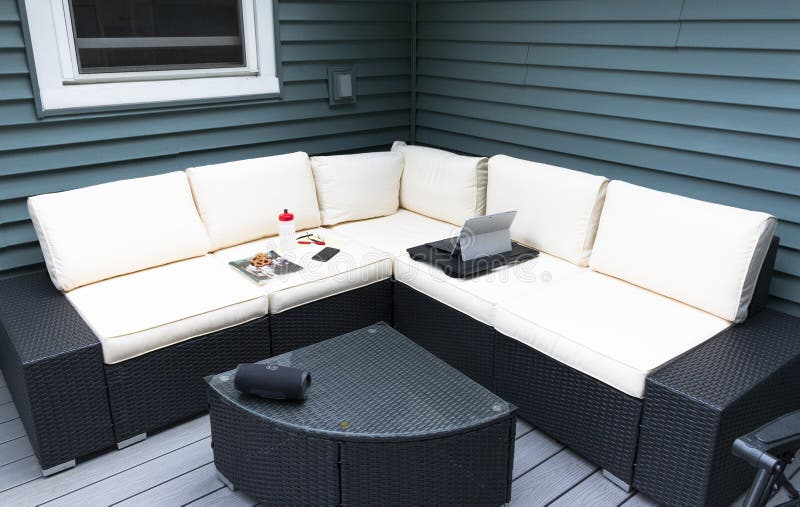 Working from Home on a Wicker Couch Outside on Composite Deck Stock ...