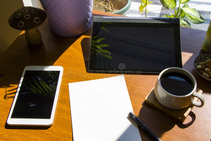 Working from Home, Workspace with Tablet and Mobile Phone, Coffee and ...