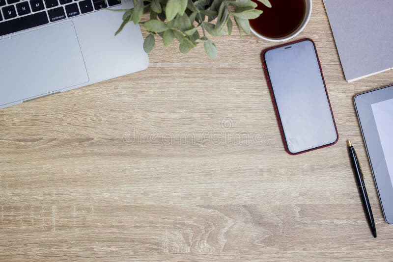 Working Items with Computer, Note and Green Leave on Wooden Table ...