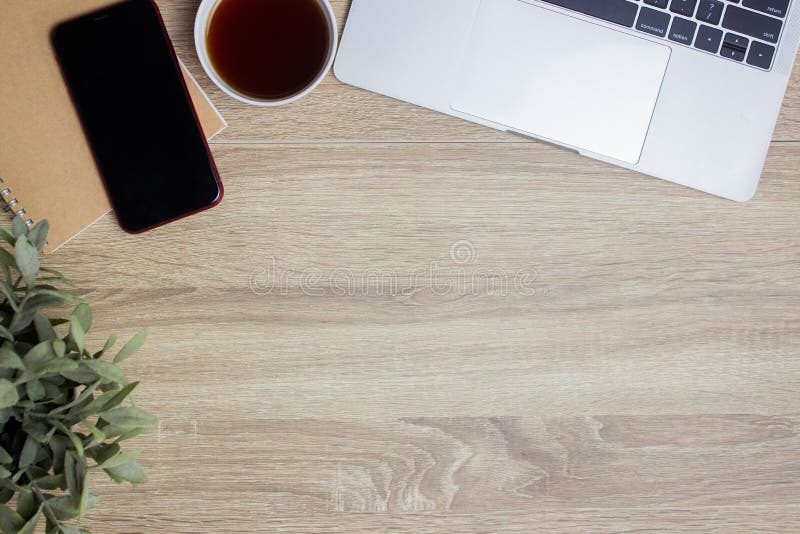 Working Items with Computer, Note and Green Leave on Wooden Table ...