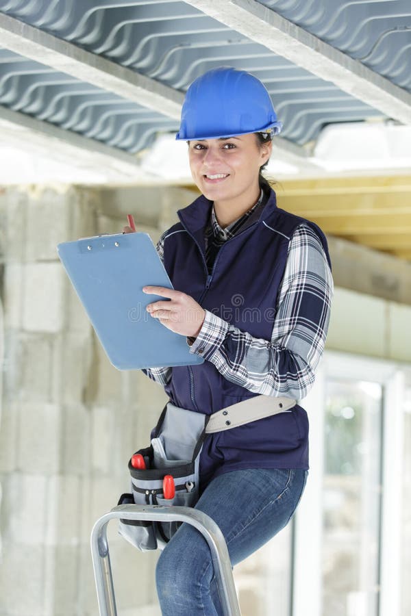 Working on Ladder and Clipboard Stock Image - Image of interior, woman ...