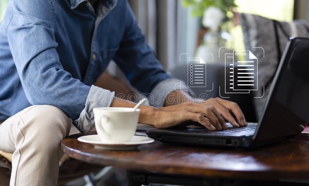 Working on Laptop with Document Icon To Management Data Record System ...