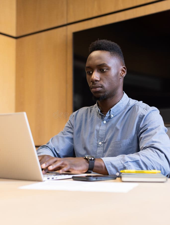 Working on Laptop, Man Focusing on Business Tasks in Modern Office ...