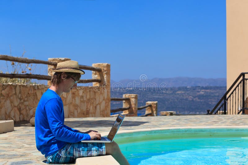 Working on Laptop at the Pool Stock Image - Image of modern, resort ...