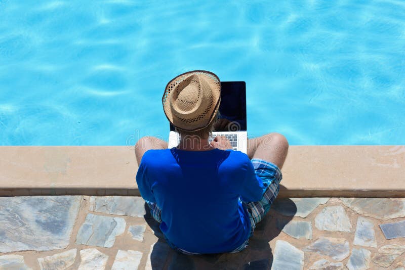 Working on Laptop at the Pool Stock Photo - Image of resort, internet ...