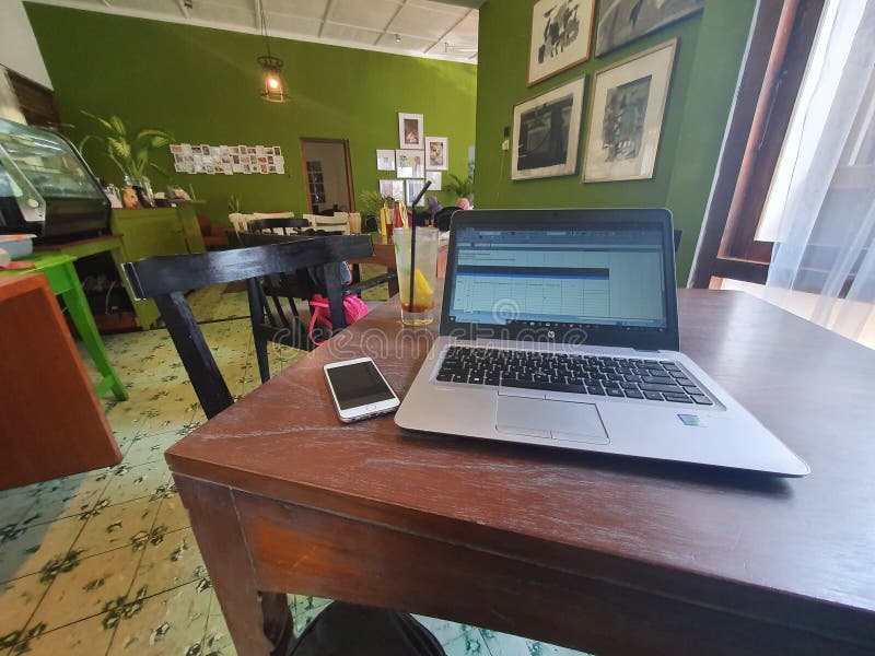 Working on a Laptop in a Quiet Cafe Editorial Stock Image - Image of ...