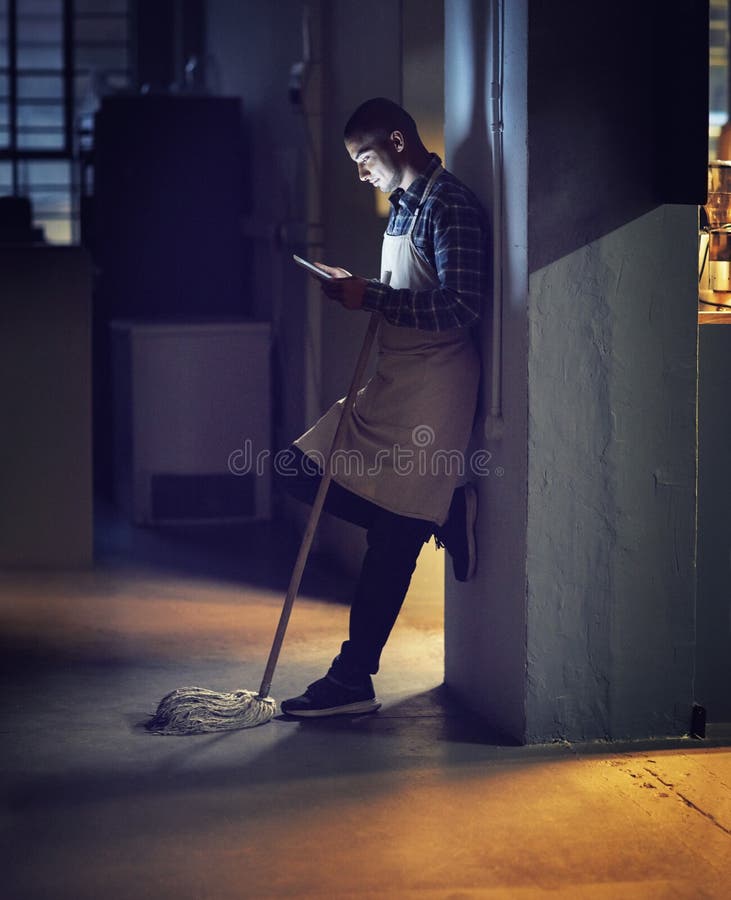 Working the Late Night Shift. a Young Man Working Late on a Digital ...