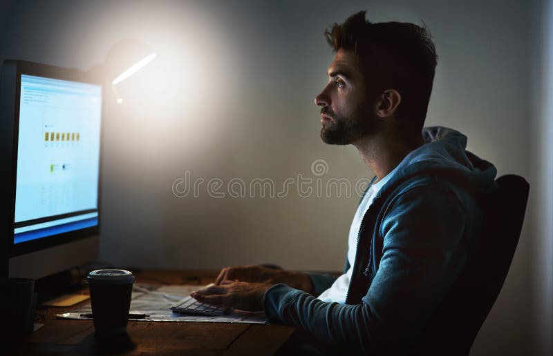 Working Late into the Night. a Young Designer Working Late in the ...