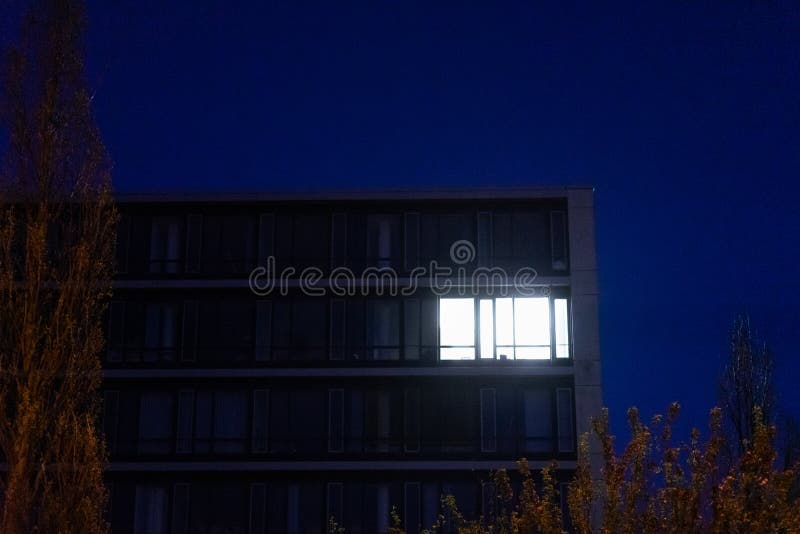 Working Late: Single Illuminated Office at Night Stock Photo - Image of ...