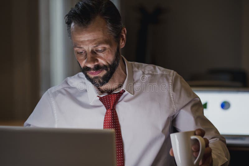 Working Late To Get it Finished by the Deadline Stock Image - Image of ...