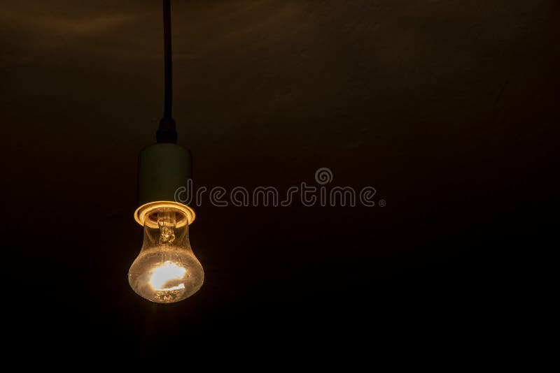 A Working Light Bulb, Light in the Dark, Background for Authors. Stock ...