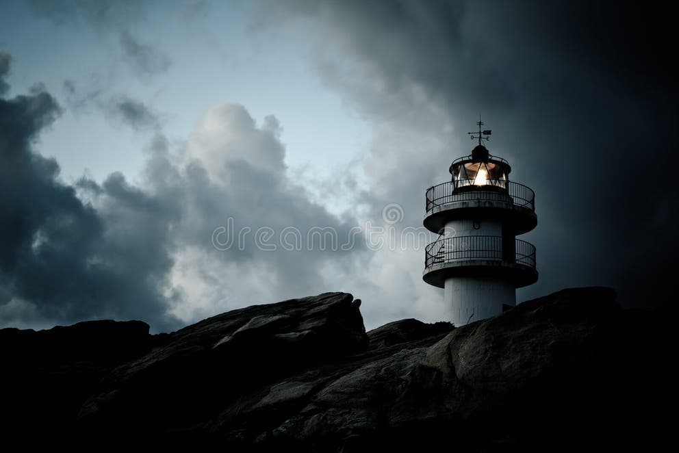 Working Lighthouse at Bad Weather Stock Photo - Image of cliff, cloud ...