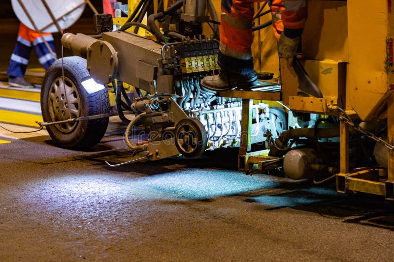 The Working Machine Performs Repair Work on the Road in the Night Stock ...