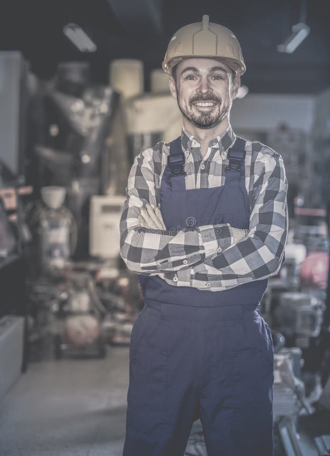 Working Man Demonstrating His Workplace and Tools at Workshop Stock ...