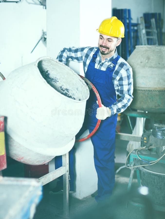Working Man Practicing His Skills with Mixing Unit at Workshop Stock ...
