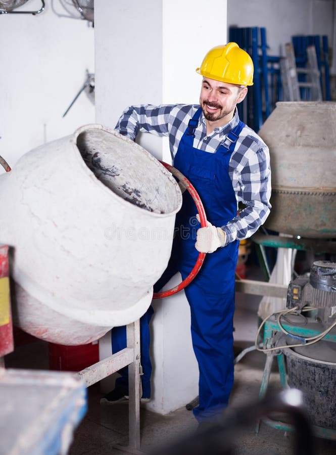 Working Man Practicing His Skills with Mixing Unit at Workshop Stock ...