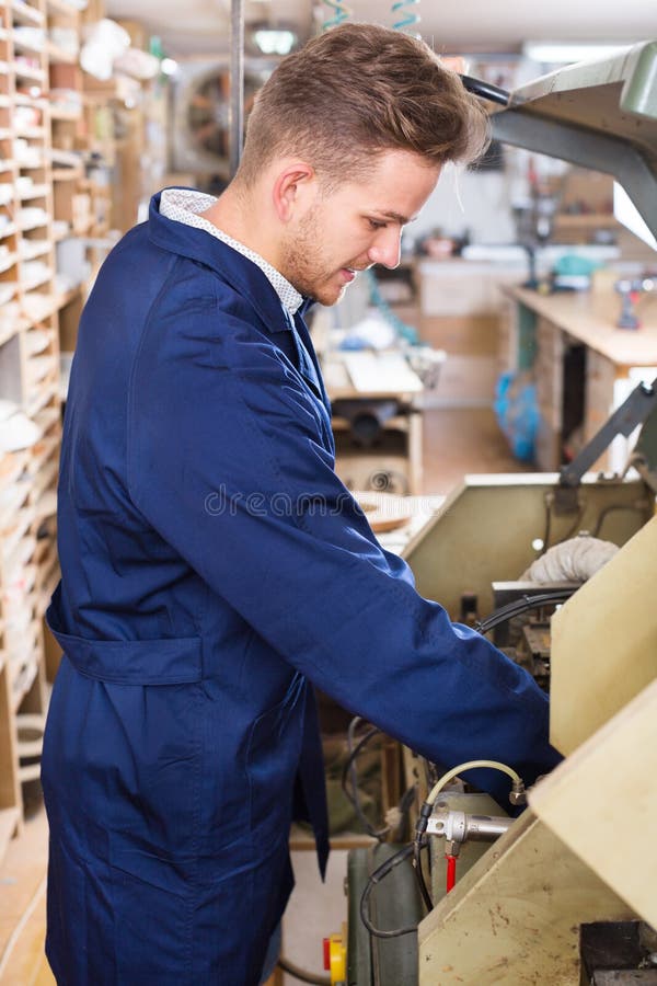 Working Man Practising Skills with Trimming Machine Stock Image - Image ...