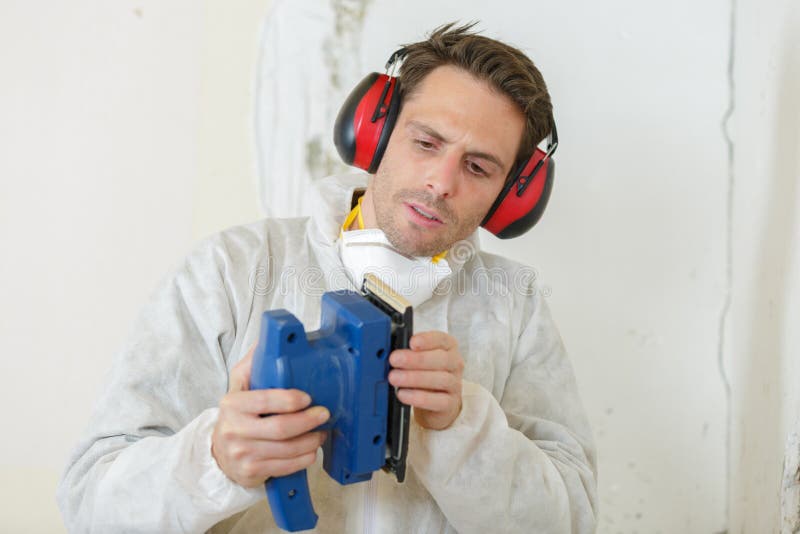 Working Man with Sanding Machine in Hand Stock Photo - Image of sander ...