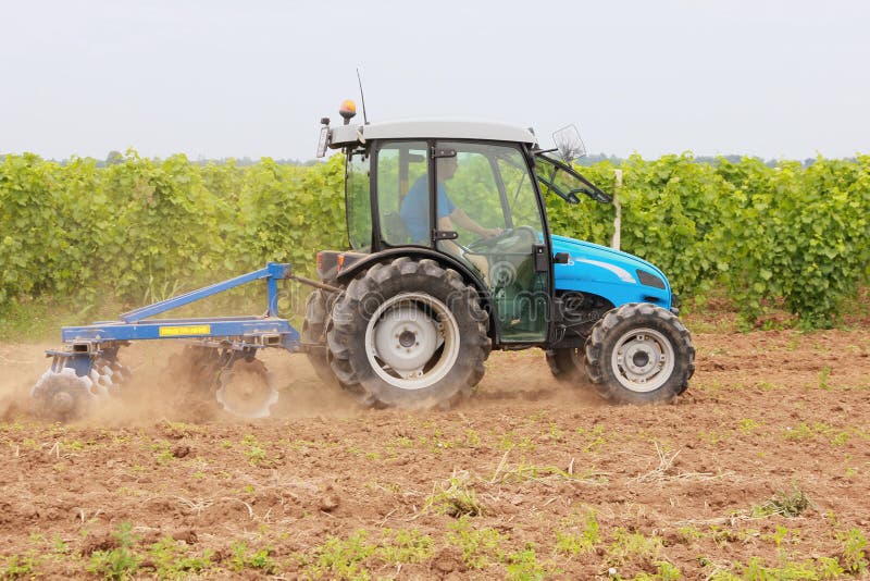 Working man on tractor stock image. Image of farming - 32295389