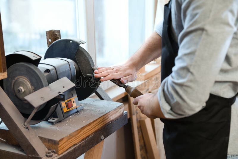 Working Man Using Grinding Machine at Carpentry Shop Stock Photo ...