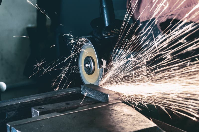 The Working Mechanic Cleans the Metal by Grinding Stock Photo - Image ...