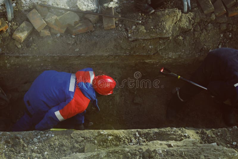 Working Men in the Form of Standing Around a Sand Pit Stock Photo ...