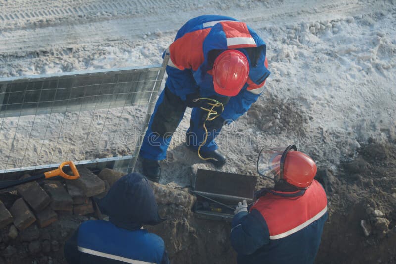 Working Men in the Form of Standing Around a Sand Pit Stock Photo ...
