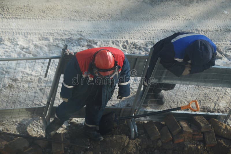 Working Men in the Form of Standing Around a Sand Pit Stock Photo ...