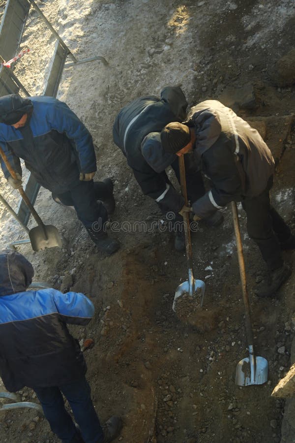 Working Men in the Form of Standing Around a Sand Pit Editorial ...