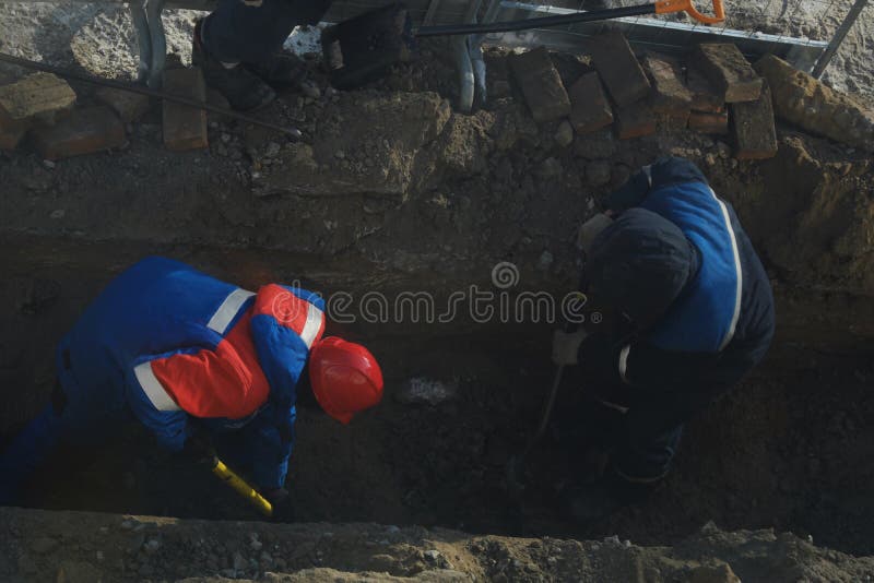 Working Men in the Form of Standing Around a Sand Pit Stock Photo ...