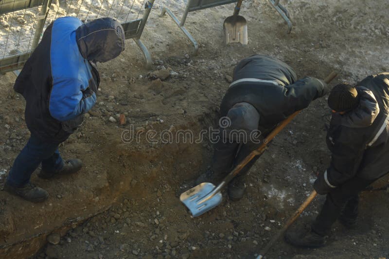 Working Men in the Form of Standing Around a Sand Pit Editorial ...