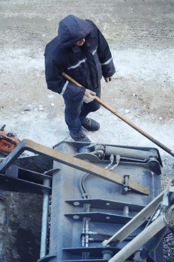Working Men in the Form of Standing Around a Sand Pit Editorial ...