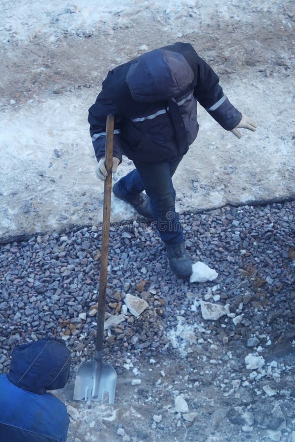 Working Men in the Form of Standing Around a Sand Pit Editorial ...