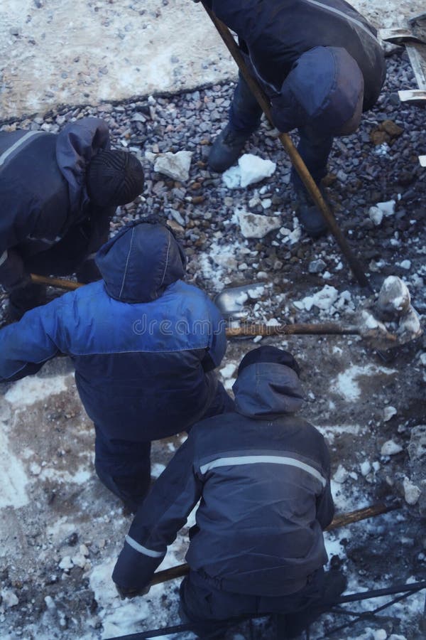 Working Men in the Form of Standing Around a Sand Pit Editorial ...