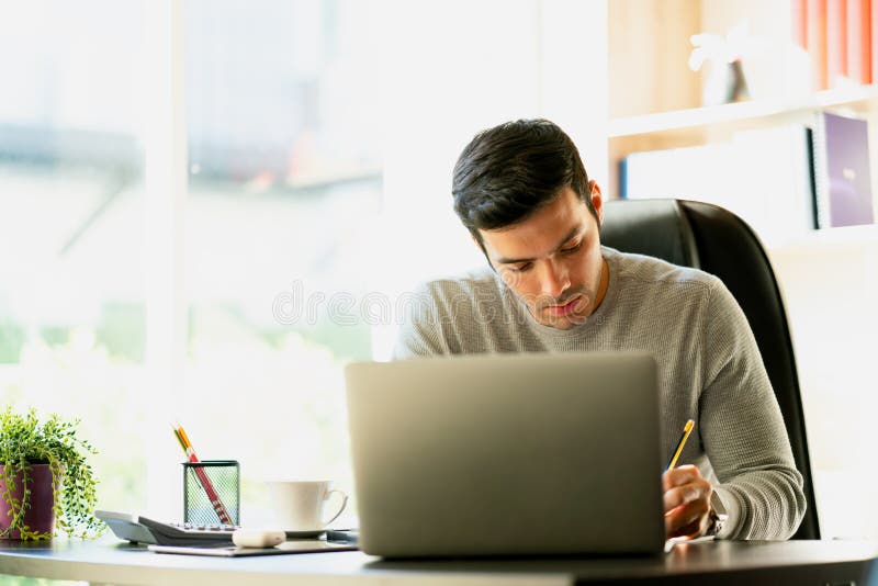 Working Men Taking Notes. Caucasian Man Working on a Computer Desk in a ...
