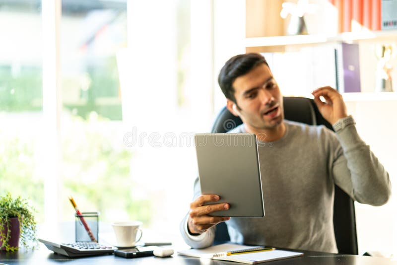 Working Men Using Tablet. Caucasian Man Working on a Computer Desk in a ...